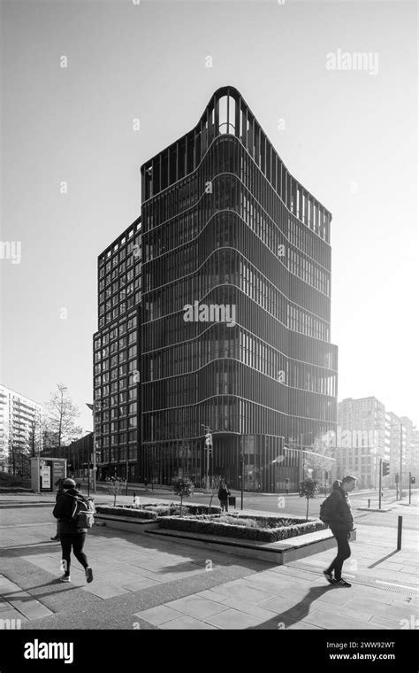 People Walking Passed The Building Early In The Morning The Gantry