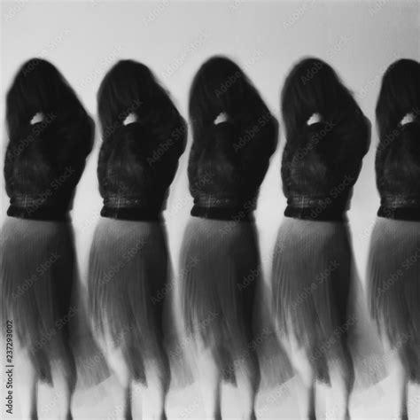 Black And White Repetition Of Unrecognisable Woman Wearing Long Skirt