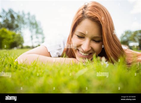 Pretty Redhead Happy And Lying Stock Photo Alamy