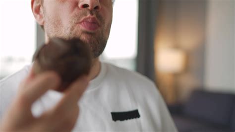 Man Eating Sweet Chocolate Donut Close Up 24585157 Stock Video At Vecteezy