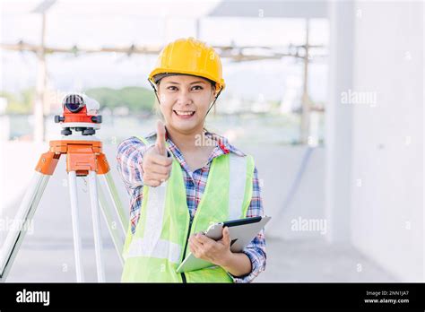 Asian Woman Engineer Worker Work In Construction Site Smart Builder Architect Female In Safety