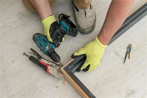 Drilling A Hole In The Door Frame For A Corner Connection Stock Photo At Vecteezy