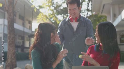 Classmate Student Friend Sit And Talk About Learning Content Subject In Classroom On Laptop