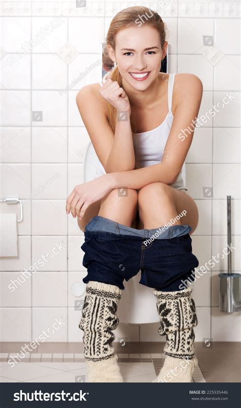 Young Woman On Toilet