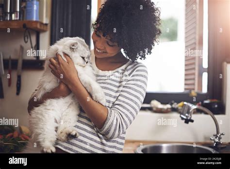 Arent You The Cutest Shot Of A Young Woman Enjoying A Cuddle With Her