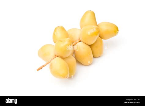 Fresh Yellow Dates Isolated On A White Studio Background Stock Photo Alamy
