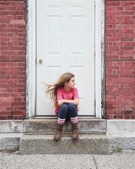 Girl Waiting Outside Door Building By Stocksy Contributor Angela Waye Stocksy