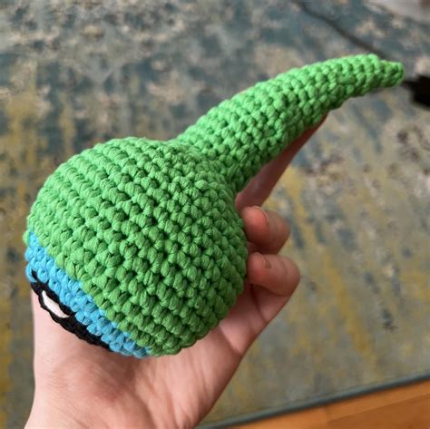learning to crochet and had to make myself a sam amigurumi 👁️💚 very pleased with him r