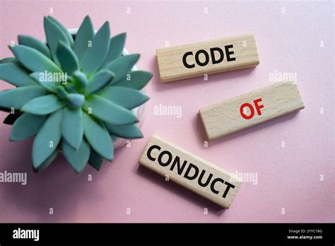 Code Of Conduct Symbol Wooden Blocks With Words Code Of Conduct Beautiful Pink Background With