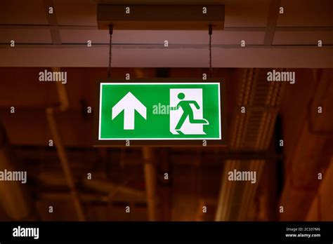 Emergency Exit Sign Glowing In The Dark Stock Photo Alamy