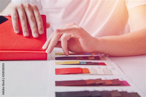 The Man Browses The Color Palette And The Material Template The Concept Of Choosing Colors For