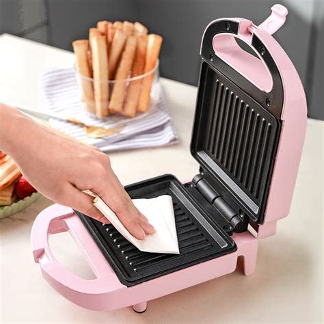 เครื่องทำแซนวิช เครื่องทำอาหารเช้า เครื่องทำขนมปัง วาฟเฟิลอบ เครื่องใช้ในครัวเรือน เครื่องอบขนาด