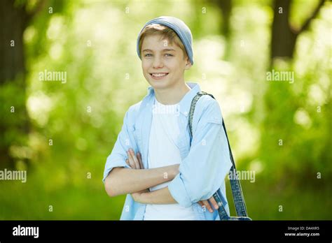 Portrait Of Cute Lad In Casual Clothes Looking At Camera Outside Stock Photo Alamy