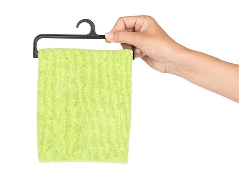 Premium Photo Hand Holding Towel On A Hanger Isolated On A White
