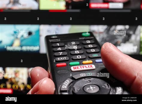 Watching Netflix On A Smart Television Using The Netflix Button On A TV Remote Control Stock