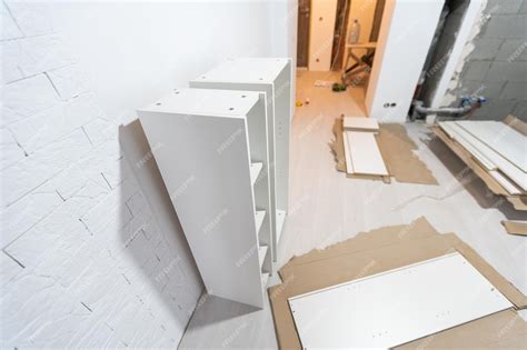 Premium Photo Parts Of Unfinished Furniture Metal Screws And Tools Lying On The Floor With