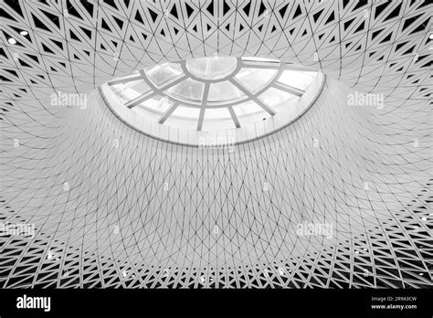 A Low Angle Of An Ornate Ceiling Inside A Building Featuring Intricate