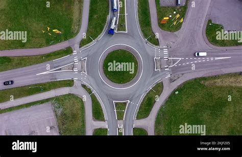 Top Down View Over Traffic Intersection With Roads And A Roundabout Stock Video Footage Alamy