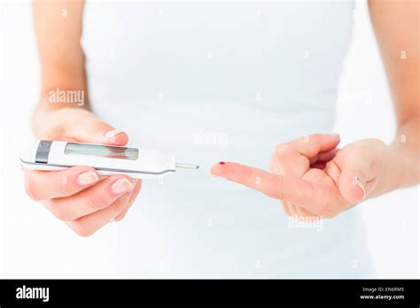 Woman Testing Her Blood Glucose Level Stock Photo Alamy