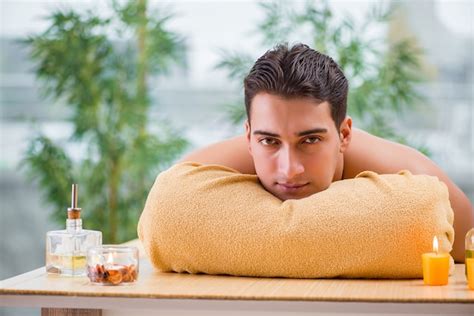 Premium Photo Handsome Man During Spa Massaging Session