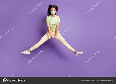Full Length View Of Girl Jumping Having Fun Fooling Wear Mask Isolated