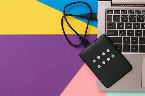 Premium Photo External Hard Drive With Laptop On Colorful Background The View From The Top