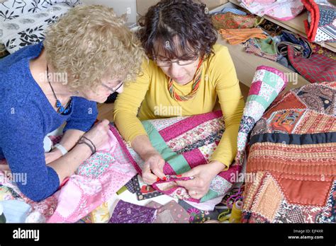 Two Women Working On Their Patchwork In The Workshop Stock Photo Alamy