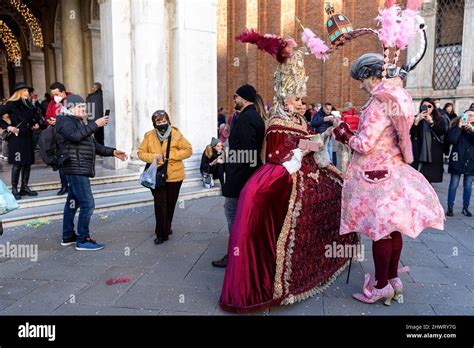 Couple In A Beautiful Traditional Venetian Costumes And Masks At The Venice Carneval St Mark S