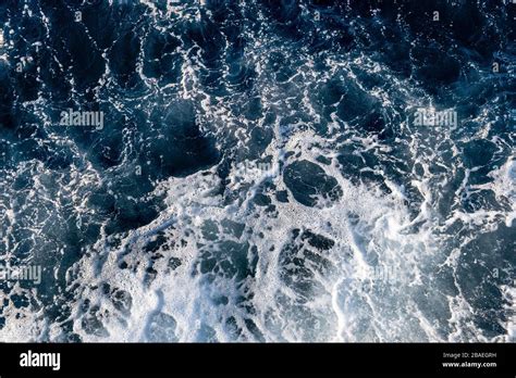 Top Down Aerial View Of Sea Water Surface White Foam Waves Texture As