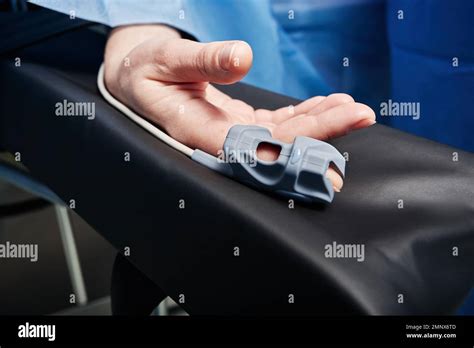 Pulse Oximeter On Patients Finger For Detection Of Oxygen Saturation