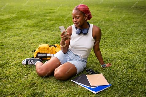 Premium Photo Portrait Of Braless Woman Outdoors With Smartphone