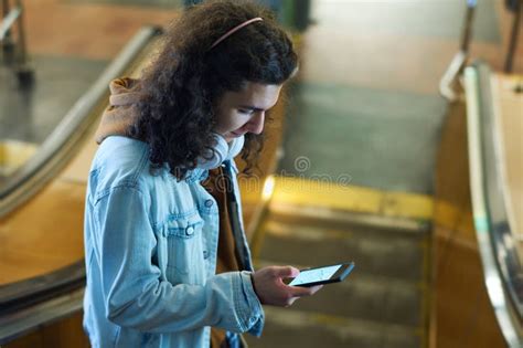 Side View Of Teenage Guy In Casualwear Scrolling Through Navigation Map