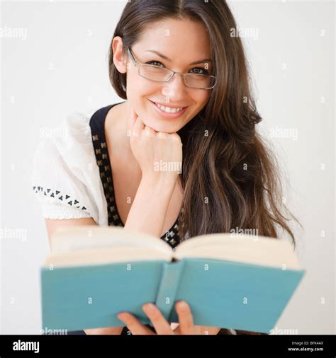 Mixed Race Woman Reading Book Stock Photo Alamy