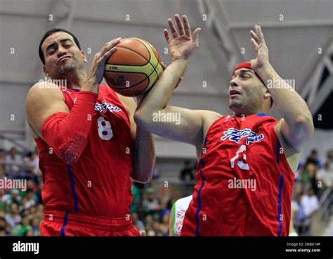 Puerto Ricos Manuel Narvaez Left And Manuel De Jesus Control A Rebound During The Mens