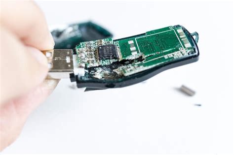 Premium Photo Close Up Of Hand Holding Broken Usb Stick