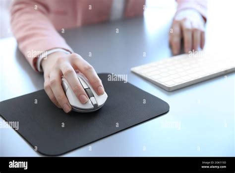 Female Hand Holding Computer Mouse On Pad Stock Photo Alamy