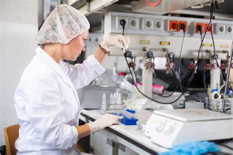 Shot Of An Adult Woman Using Equipment To Work In A Laboratory Stock Photo Image Of Equipment