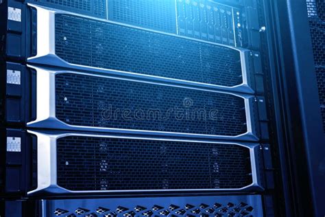 modern mainframe storage in data center close up under neon blue toning