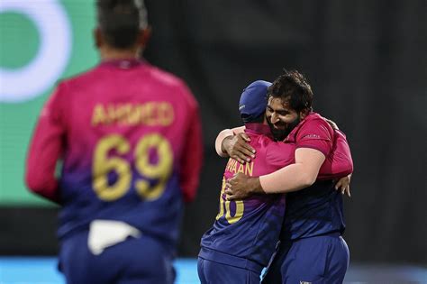 muhammad waseem gets a hug from his captain