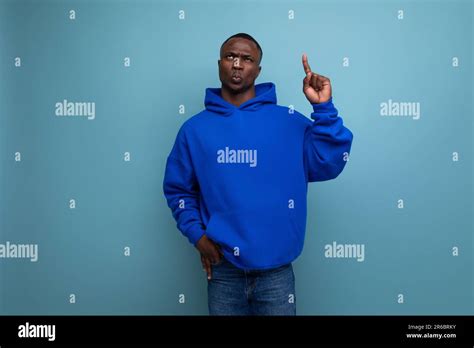 A Handsome Short Haired Brunette African In A Basic Hoodie Demonstrates