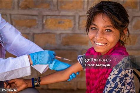 Female Doctor Is Doing An Injection To Young Indian Girl In Small