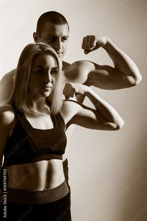 Guy And Girl Flex Biceps Muscular Couple Flexing Arms Show Me The Bicep Peak How To Build Big