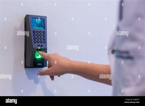 Nurse S Finger Being Scanned By A Fingerprint Scanner Stock Photo Alamy