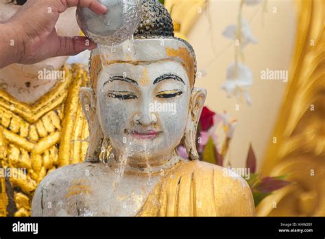 Bathing Buddha Statue For Blessing A Religious Ritual Pouring Water