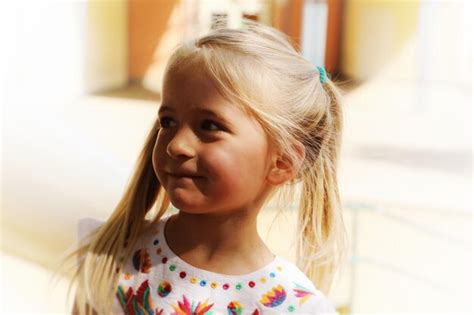 Premium Photo Year Old Blonde Girl With Angelic Smile In Miday Sun