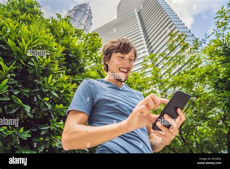 man tourist using navigation app on the mobile phone navigation map on