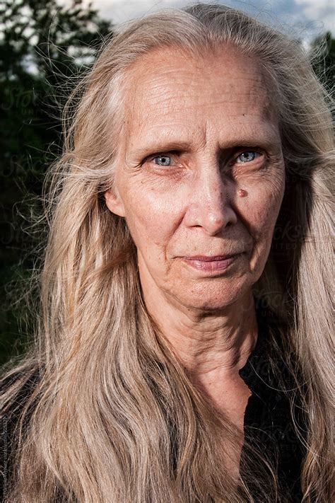 An Elderly Blonde Woman With Windblown Hair By Stocksy Contributor J