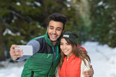 Man Hold Smart Phone Camera Taking Selfie Photo Snow Forest Young Mix