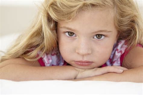 Young Girl Looking Sad On Bed In Bedroom Stock Image Image Of