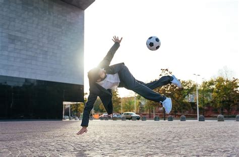 Premium Photo Businessman Playing With A Soccer Ball And Making